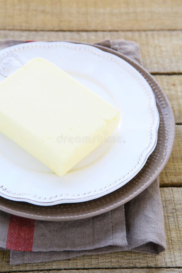Fresh butter on plate stock photo. Image of block, macro - 36720062
