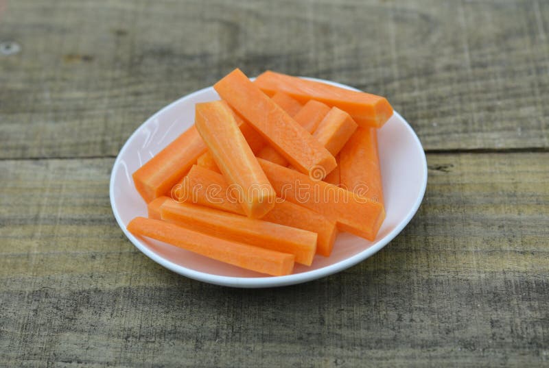 Fresh Carrot in White Plate on Wooden Stock Photo - Image of group ...