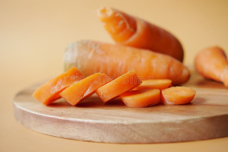 Fresh Carrots on Chopping Board on Table Stock Image - Image of cutting ...