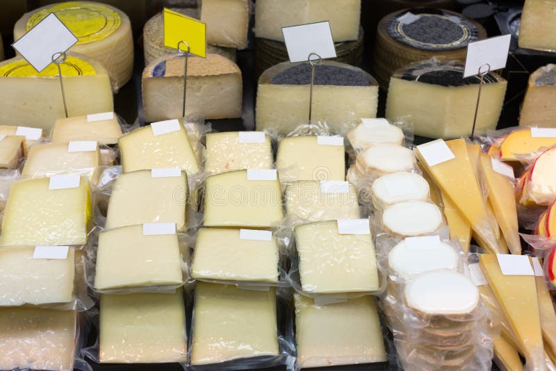 Fresh Cheese in Packs and in Bulk on Counter Stock Image - Image of ...