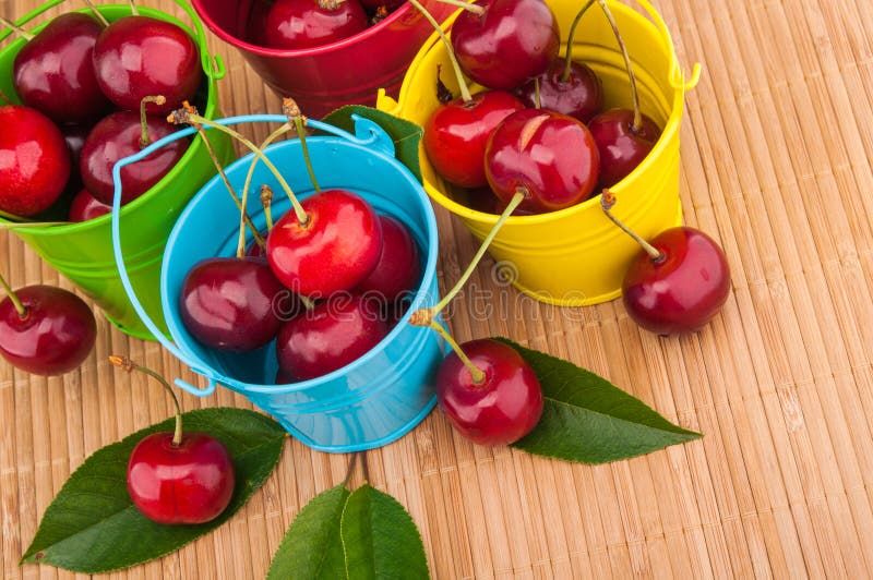 Fresh cherries in buckets stock image. Image of green - 45017243
