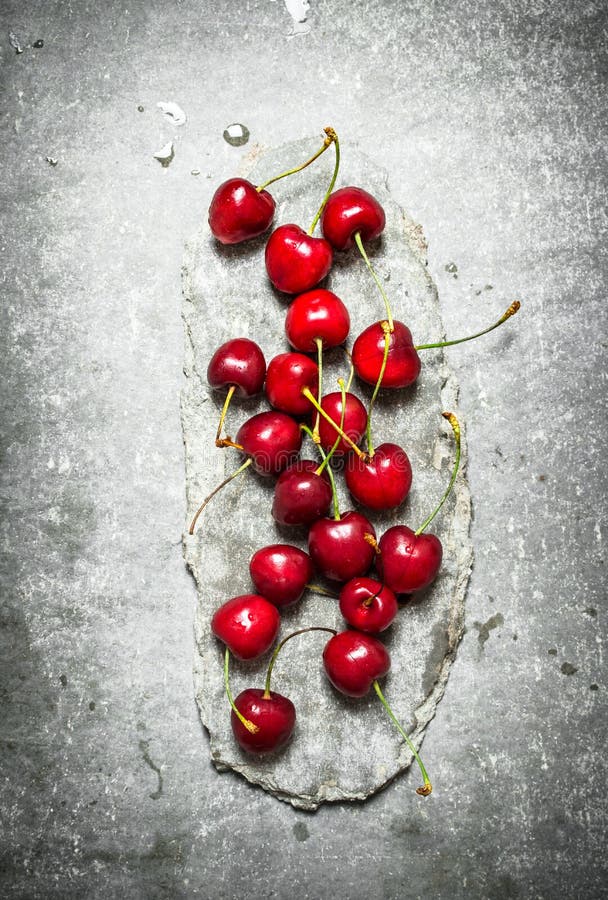 Fresh Cherry on Stone Stand. Stock Image - Image of stone, grey: 76586003