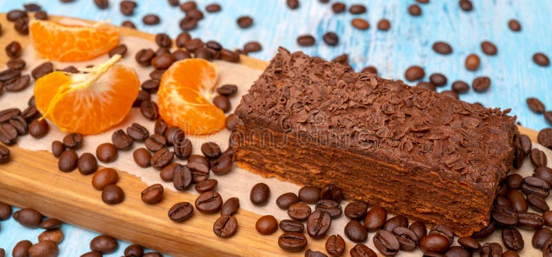 Fresh Chocolate Cake. Grains of Coffee and Slices of Mandarin Lie on ...