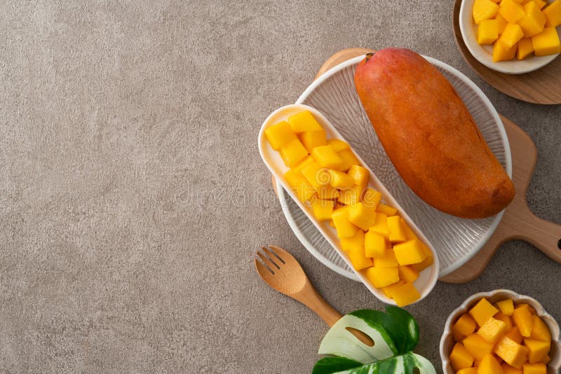 Fresh Chopped, Diced Mango Cubes on Gray Table Background with Tropical ...