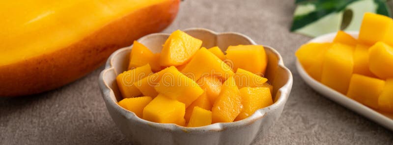 Fresh Chopped, Diced Mango Cubes on Gray Table Background with Tropical ...