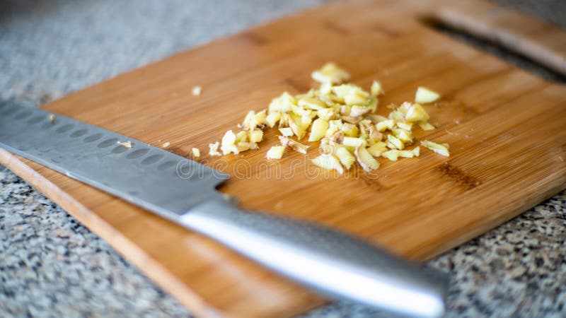 Chopped Ginger with Knife on Cutting Board Side View Stock Image ...
