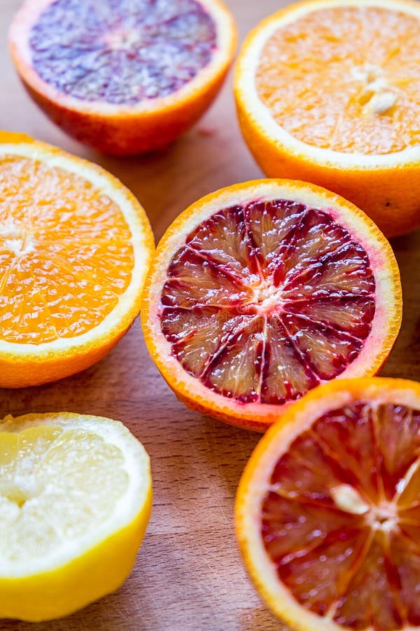 Fresh Citrus Fruits Half Cut on Woodend Background, Close-up Stock ...