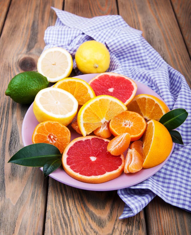 Fresh citrus fruits stock photo. Image of healthy, plate - 64577350