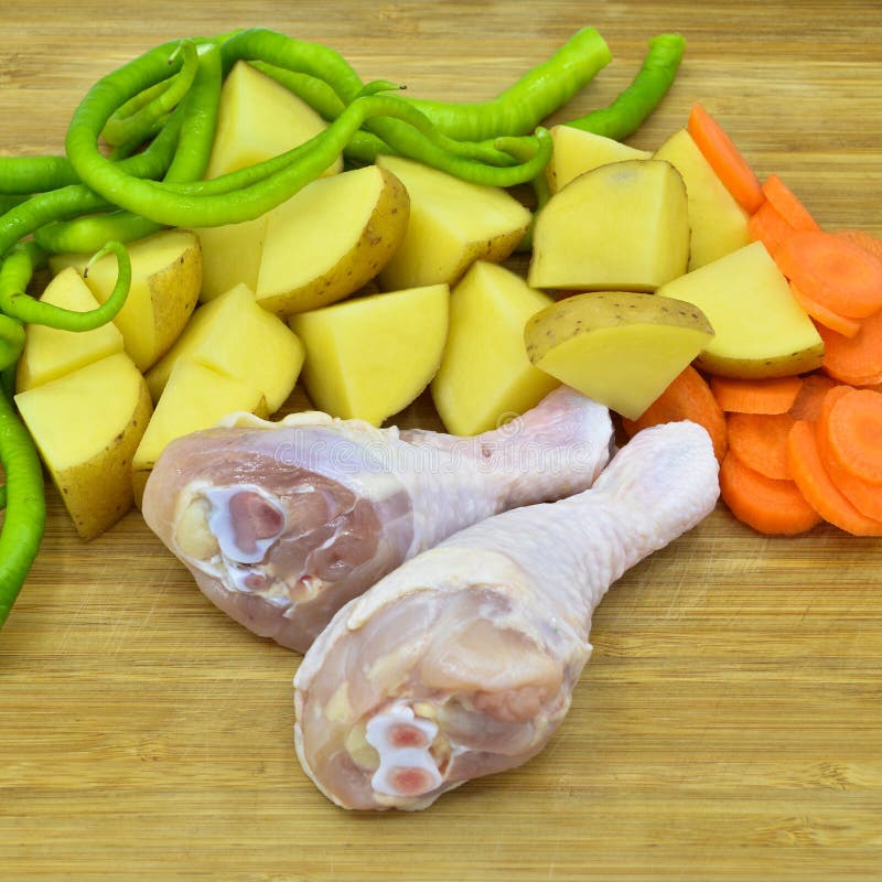 Fresh Clean Raw Chicken Legs. Drumsticks and Healthy Vegetables. Stock ...