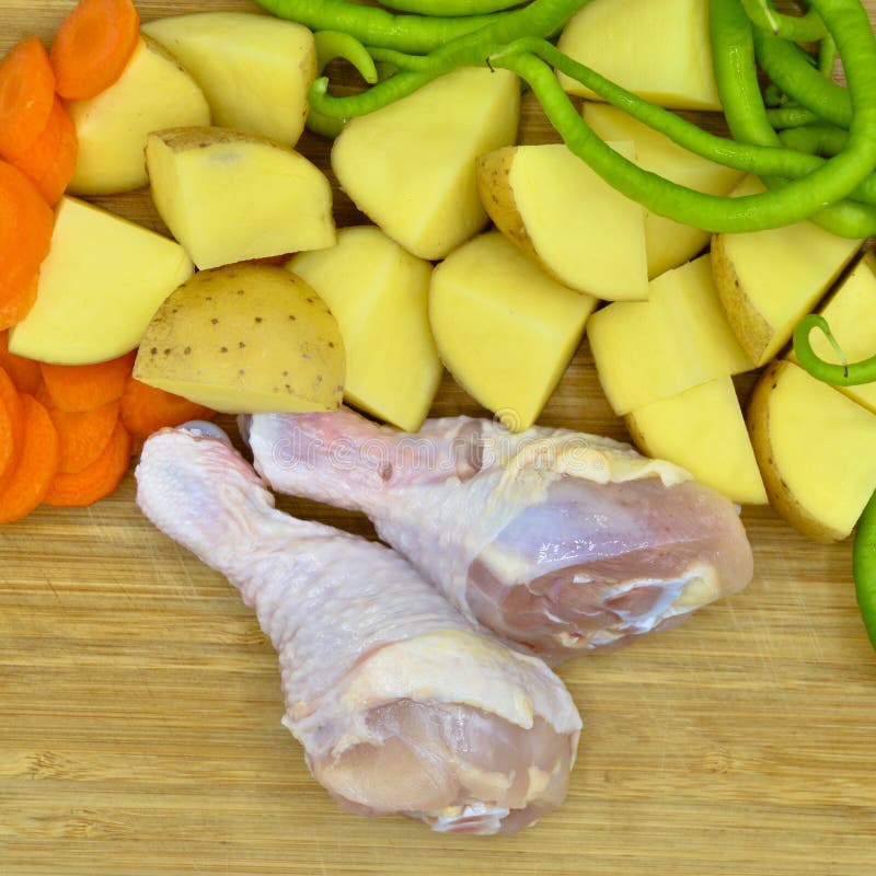 Fresh Clean Raw Chicken Legs. Drumsticks and Healthy Vegetables. Stock ...