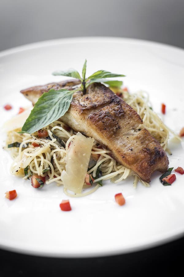 Fresh Cod Fish Fillet on Mixed Vegetable and Parmesan Spaghetti Pasta ...