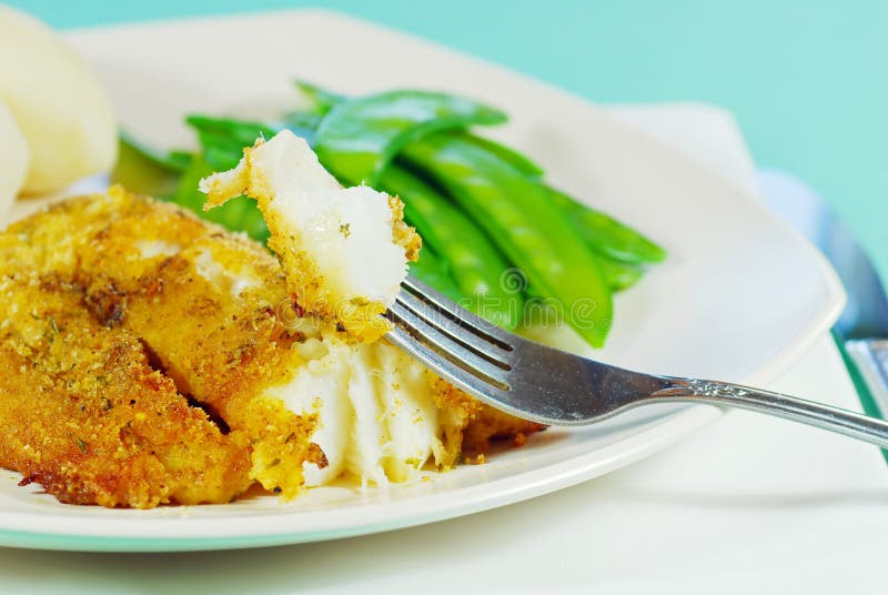 Fresh Cod on a Fork Ready To Eat Stock Photo - Image of beans, green ...