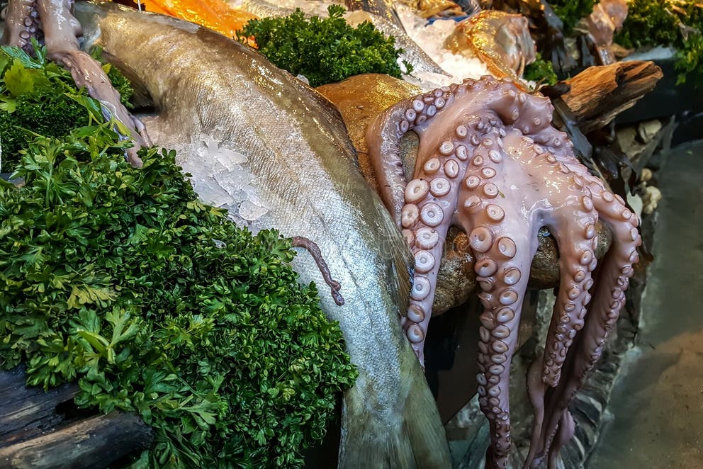 Fresh Cod and Octopus at a Fishmonger in a Marketplace Stock Photo ...