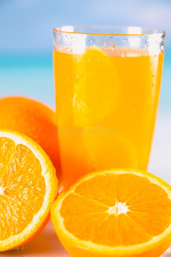 Fresh and Cold Orange Juice Served on Beach Stock Image - Image of ...