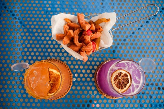Fresh Iced Butterfly Pea and Orange Soda Drinks and Fried Sausages ...