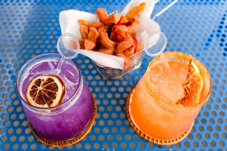 Fresh Iced Purple and Orange Soda Drinks and Fried Sausages Served on ...