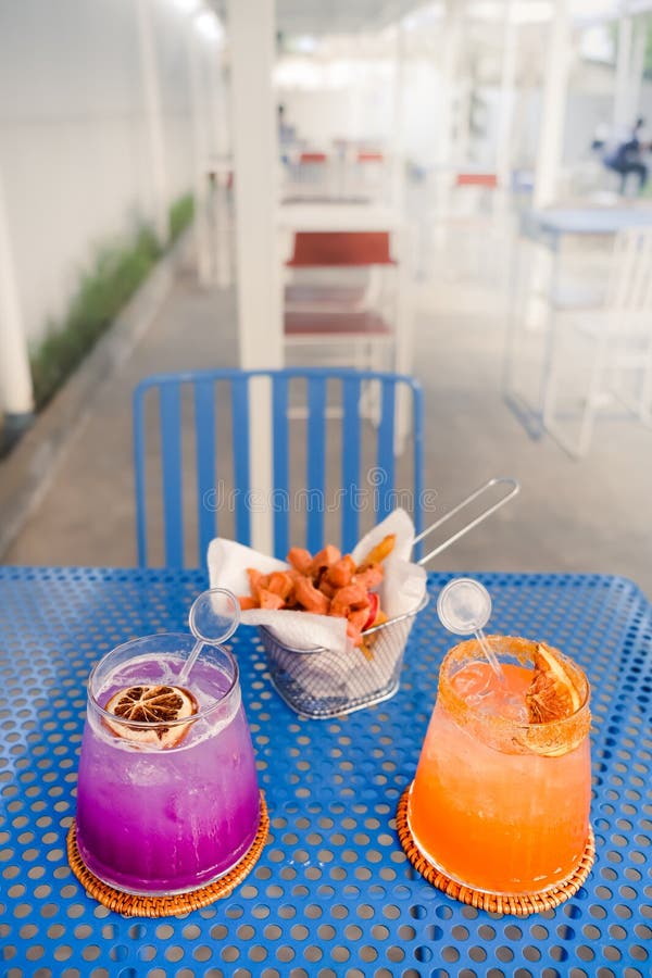 Fresh Colourful Iced Drinks and Fried Sausages Served on Table Stock ...