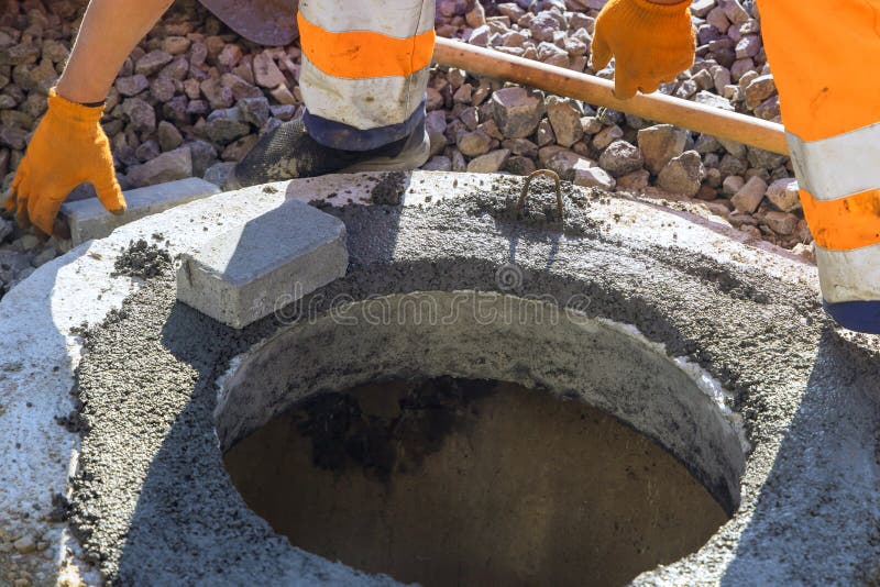 Fresh Concrete is Being Poured To Bind Blocks Forming Top Section of a ...
