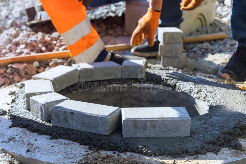 In Fresh Concrete is Securing Blocks Making Up Uppermost Edge of a ...