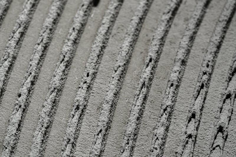 Fresh Concrete Tehture with Patterns of Notched Trowel. Macro Shot of ...