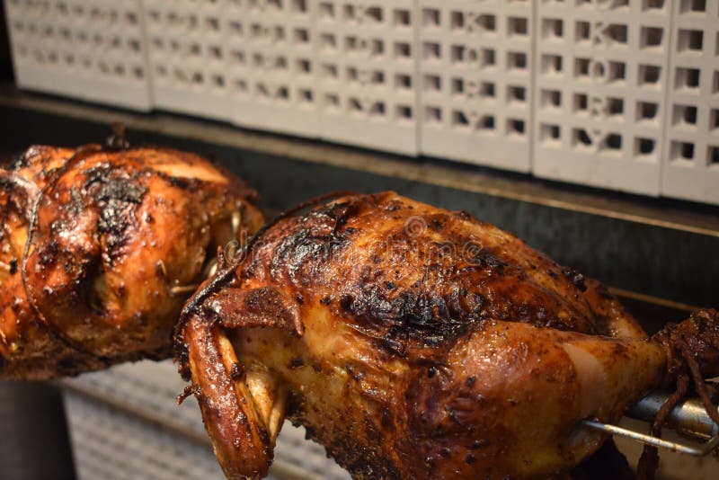 Fresh Cooked Rotisserie Chicken Still Inside the Rotisserie Stock Photo ...