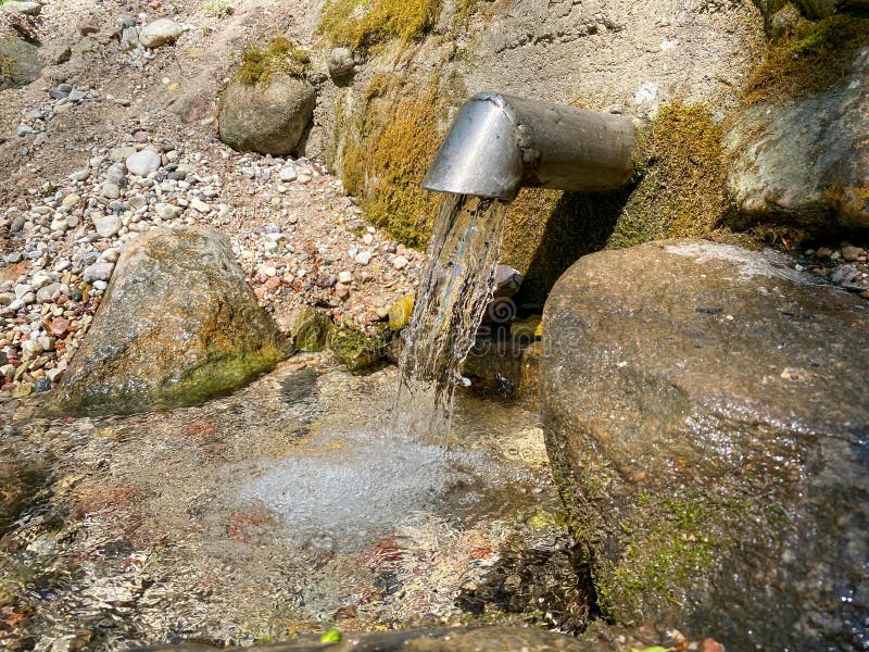 A Fresh and Cool Spring Flows from the Ground. Cool and Delicious ...