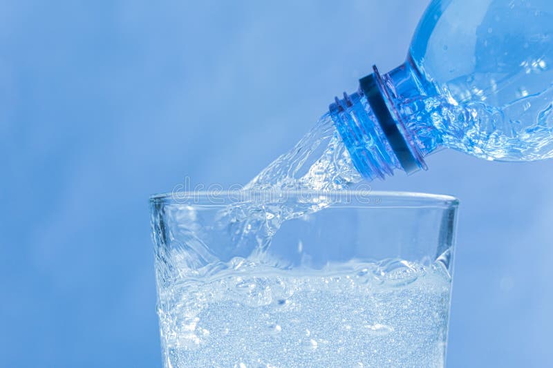 Fresh and Cool Water Flows from the Neck of the Bottle Stock Image ...