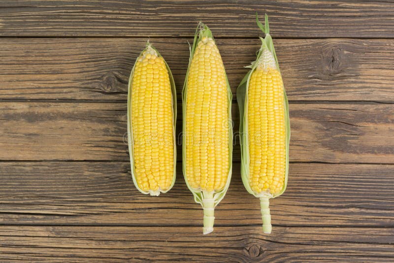 Fresh Corn on the Cob on a Rustic Wooden Table - Top View Stock Photo ...