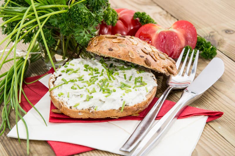 Fresh Creme Cheese on a Roll Stock Photo - Image of chives, herb: 26487184