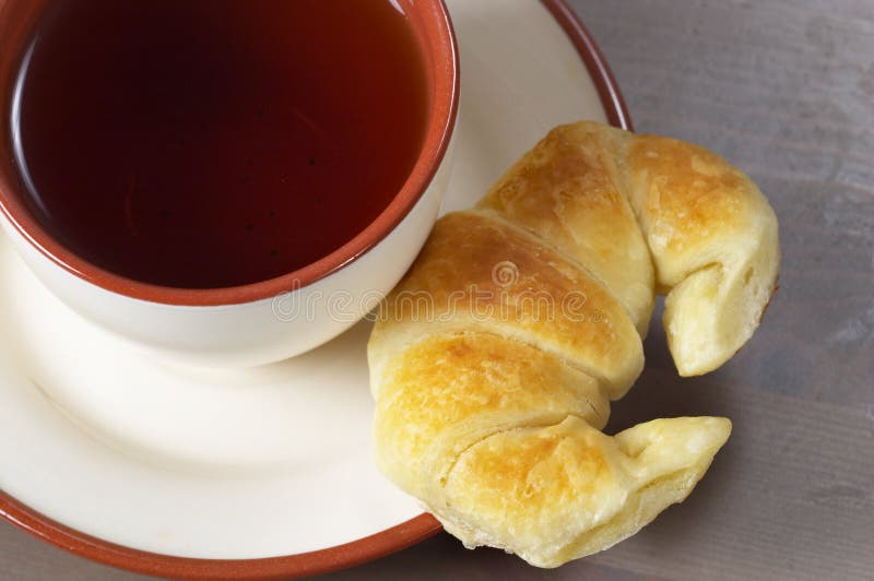 Fresh croissant and tea stock image. Image of bakery - 61139267