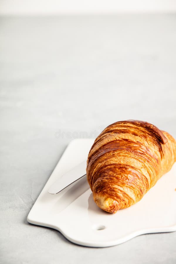Fresh Croissant on White Ceramic Board, Close Up Stock Photo - Image of ...