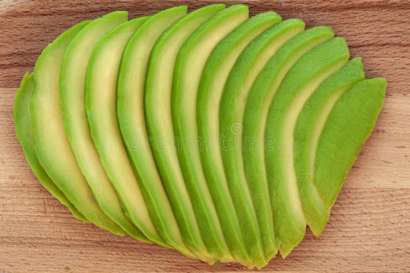 Fresh Cut Avocado Sliced on a Cutting Board Stock Photo - Image of ...