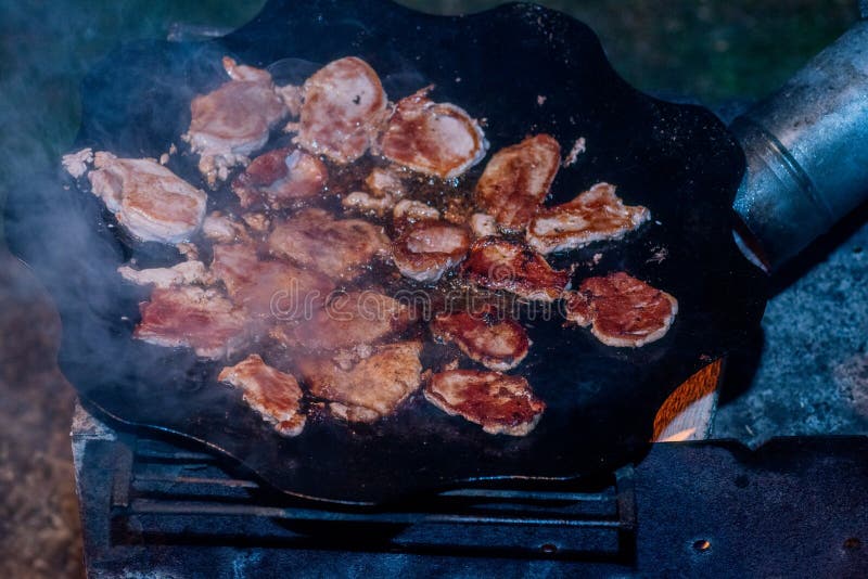 Fresh Cut Bacon Being Cooked Over a Campfire Stock Photo - Image of ...