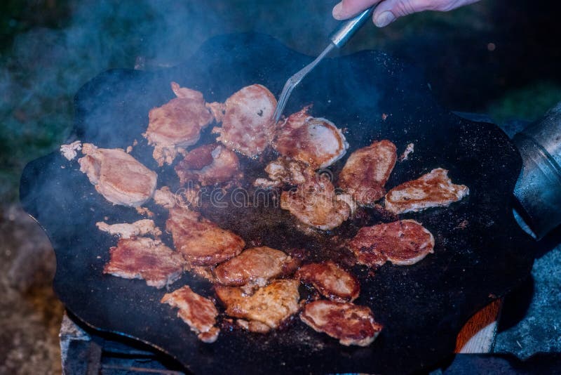 Fresh Cut Bacon Being Cooked Over a Campfire Stock Image - Image of ...