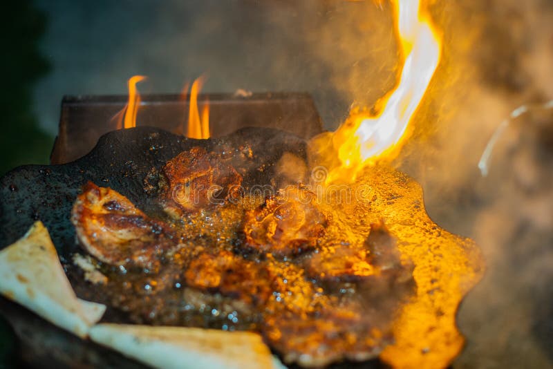 Fresh Cut Bacon Being Cooked Over a Campfire. Meat in a Frying Pan Over ...