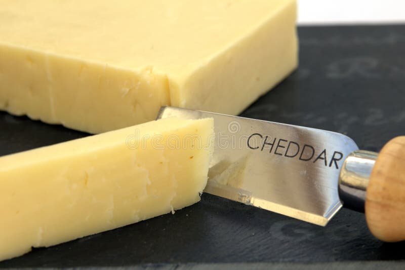 Fresh Cut Cheddar Cheese on a Slate Board Stock Photo - Image of cheese ...