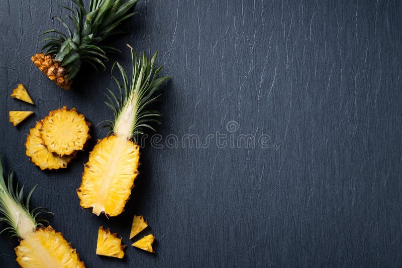 Fresh Cut Pineapple with Tropical Leaves on Dark Blue Background Stock ...