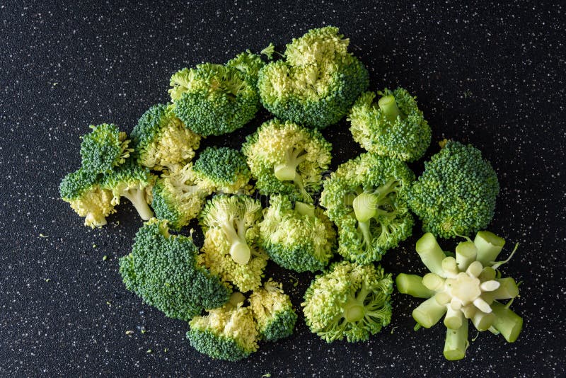 Fresh Cut Up Florets of Broccoli Ready for Cooking, Large Black Cutting ...