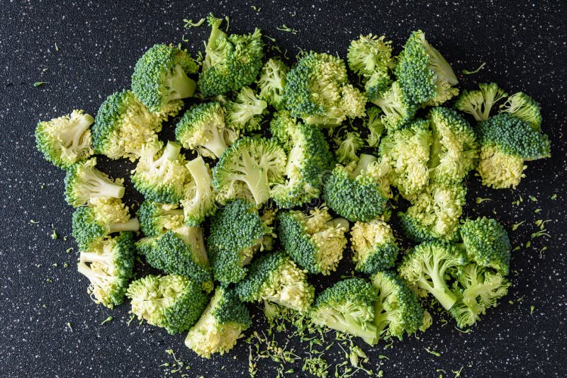 Fresh Cut Up Florets of Broccoli Ready for Cooking, Large Black Cutting ...
