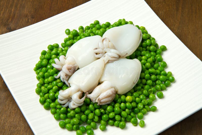 Fresh cuttlefish with peas stock photo. Image of taste - 21269378