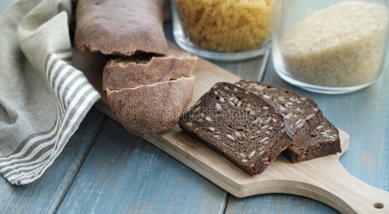 Fresh Dark Rye Bread with Whole Grain on Rustic Wood Stock Image ...