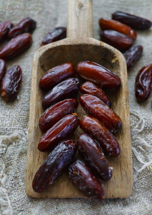 Fresh Dates on a Wooden Old Tray Lying on the Table Stock Photo - Image ...