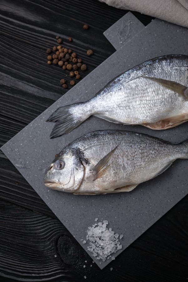Fresh Dorada on a Gray Board, Dark Background Stock Image - Image of ...
