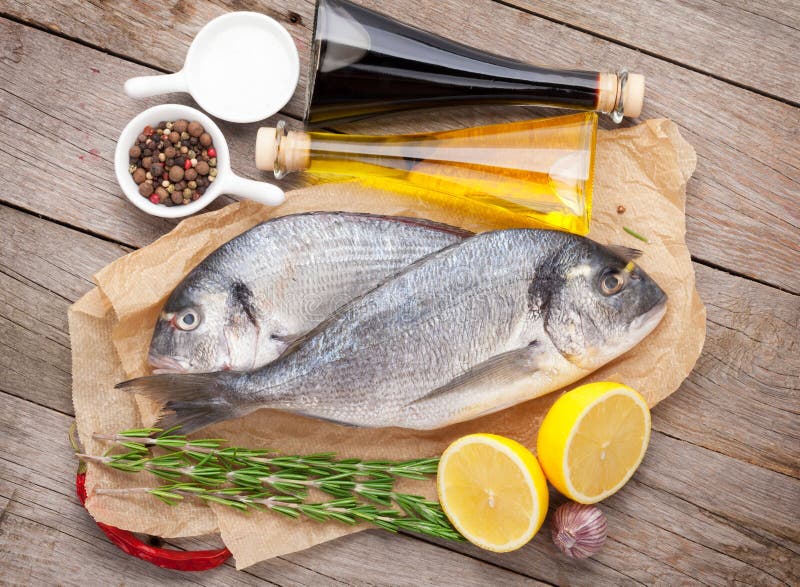 Fresh Bream Fish on Cutting Board with Ingredients Stock Image - Image ...