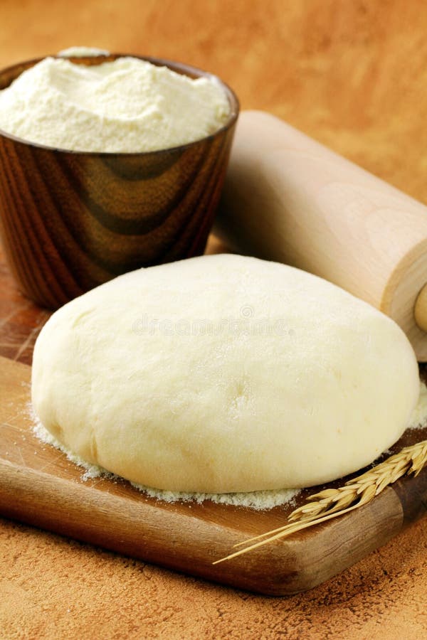 Fresh dough with flour stock image. Image of food, background - 23786957
