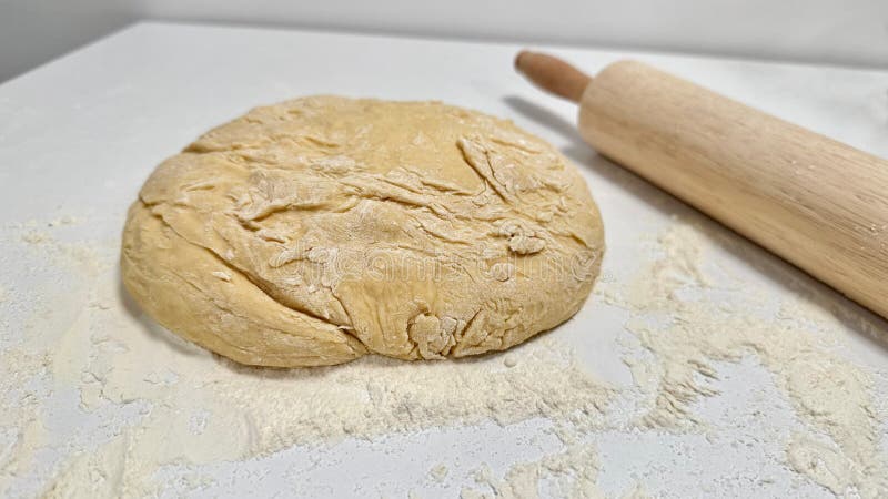 Fresh Dough Ready for Baking with a Rolling Pin and Flour Dusting Stock ...