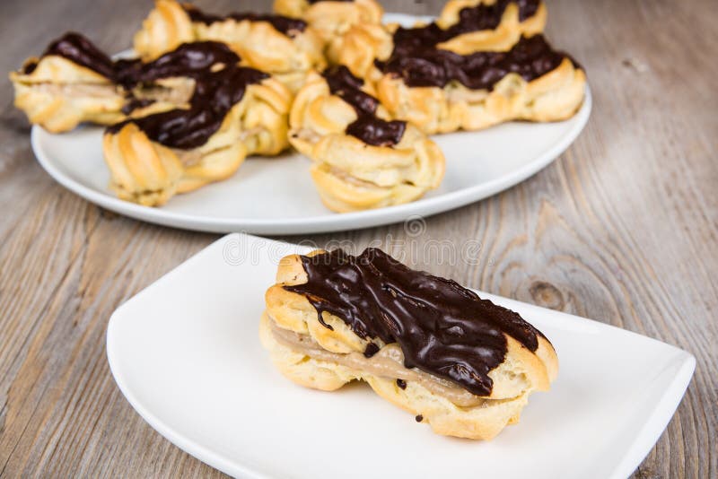 Fresh Eclairs with Coffee Cream Inside and Chocolate Stock Image ...
