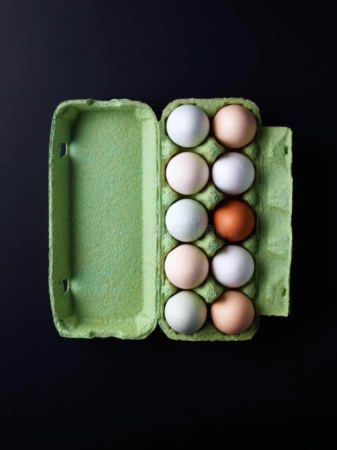 Fresh Eggs in Box on Black Background, from Above Stock Image - Image ...