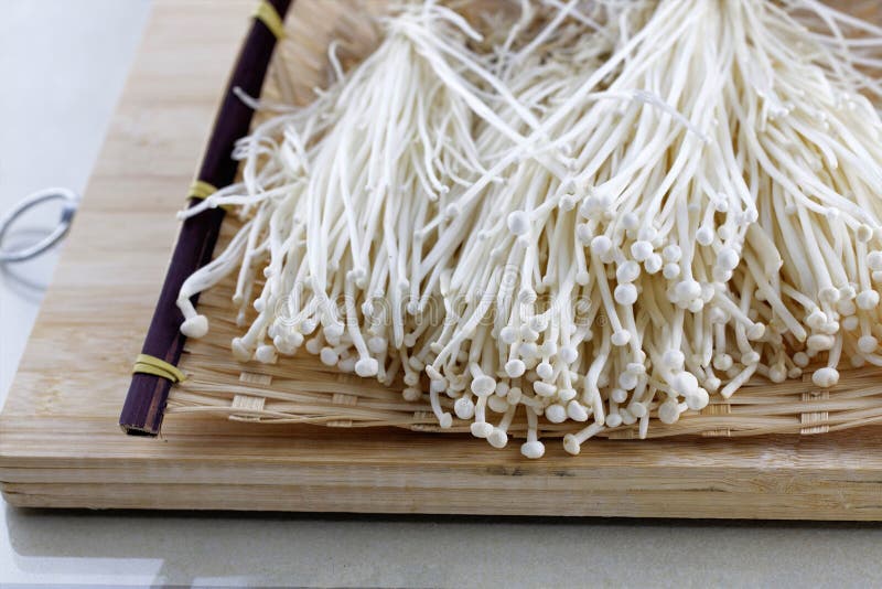 Fresh of enoki mushrooms stock photo. Image of delicious - 65399352