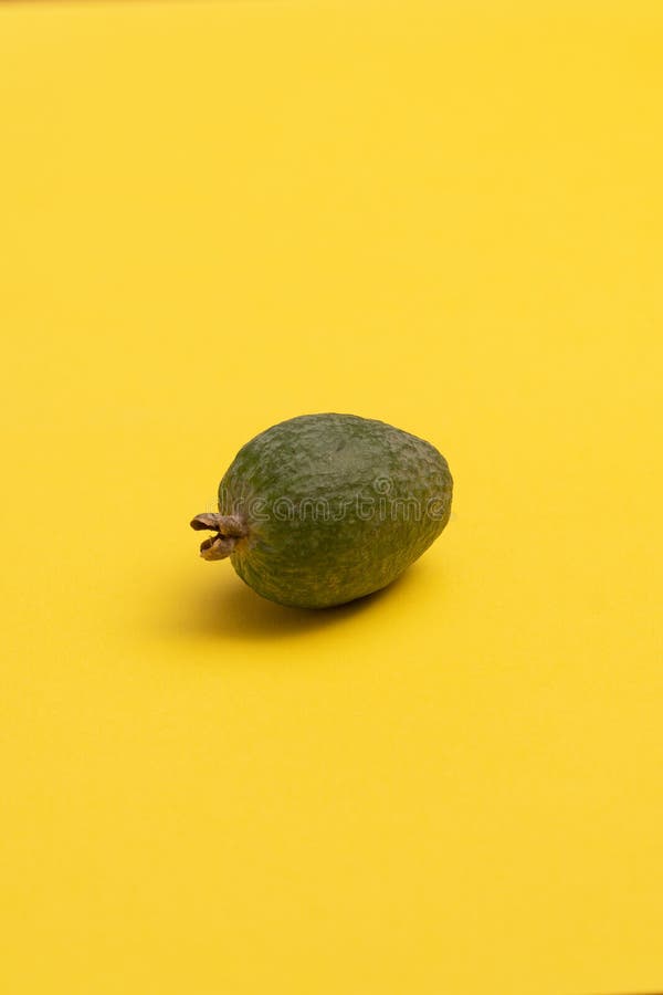 Fresh Feijoa Fruit on Bright Yellow Surface. Studio Close-up Shot ...